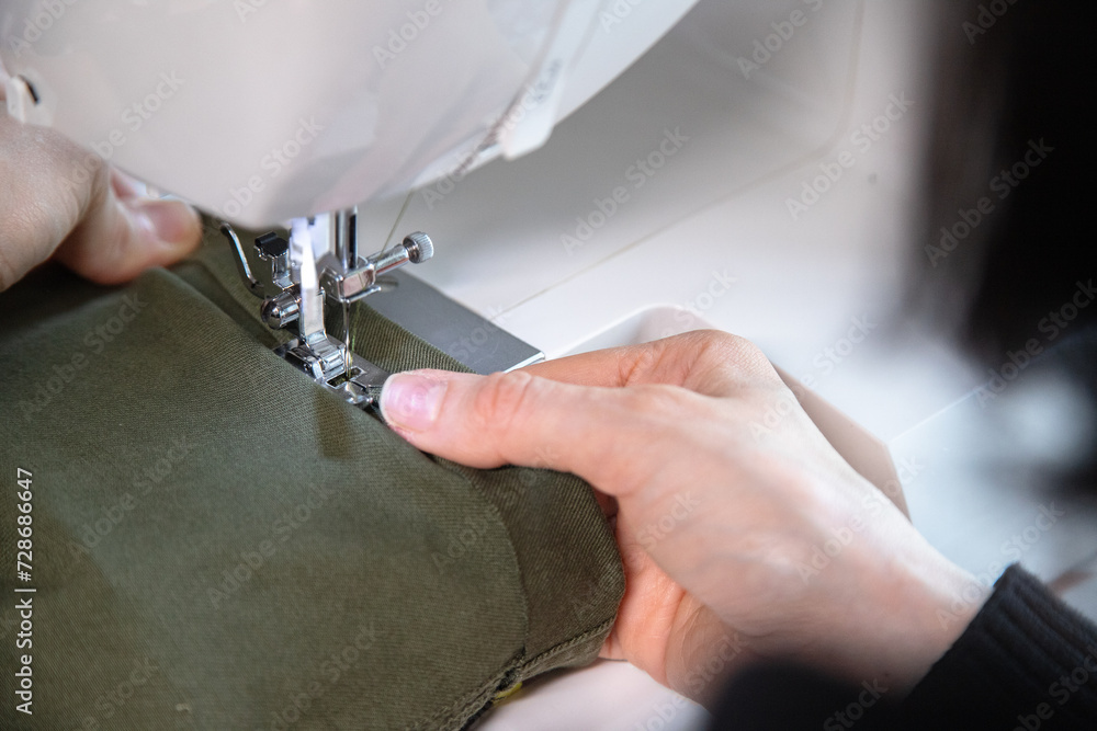 Detail of sewing work execution. Recycling clothes at home to reduce ...