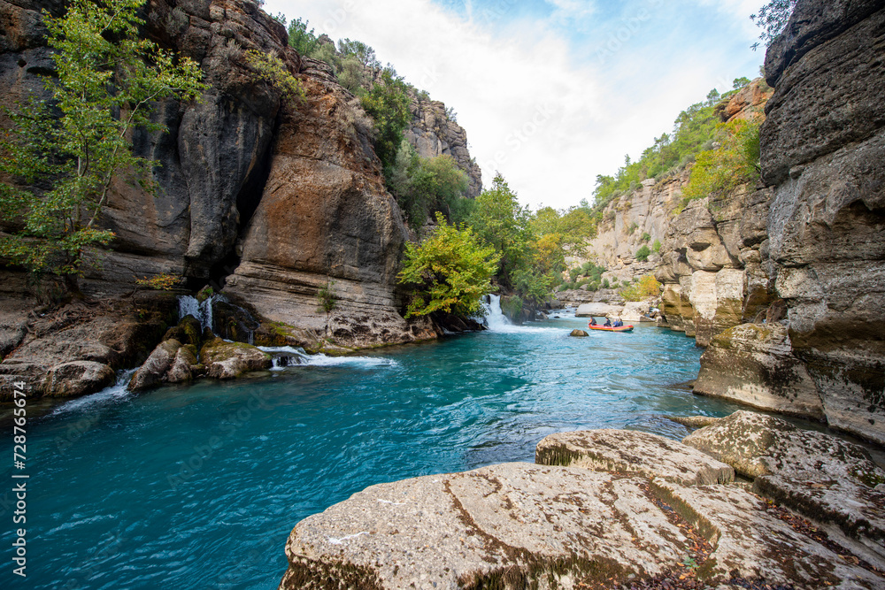 Transparent waters of Kopru River (Köprüçay, ancient Eurymedon) with ...
