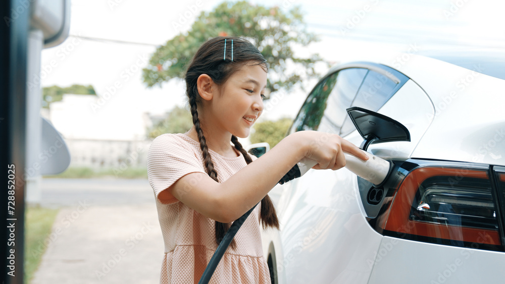 Happy little young girl learn about eco-friendly and energy ...