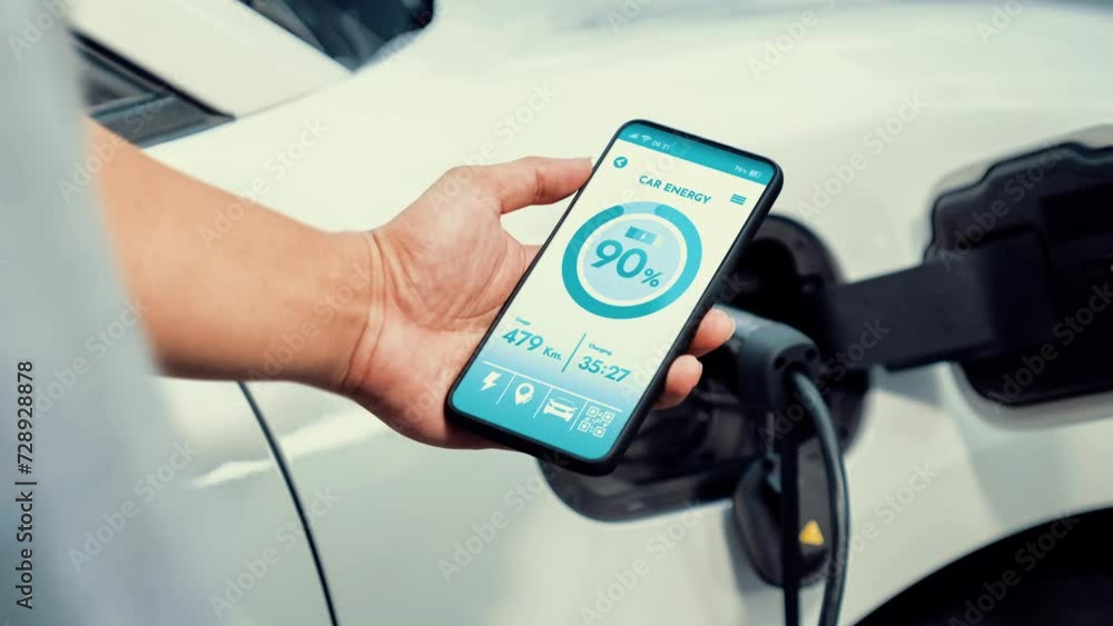 Smartphone display battery status on smart EV mobile application while ...