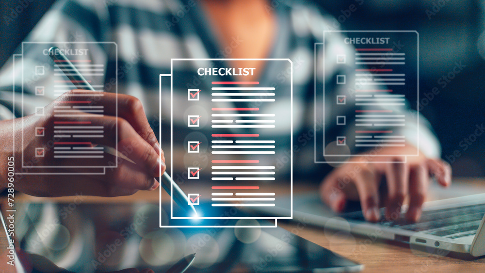 A woman uses a pen marking to explore the topics on the digital form ...