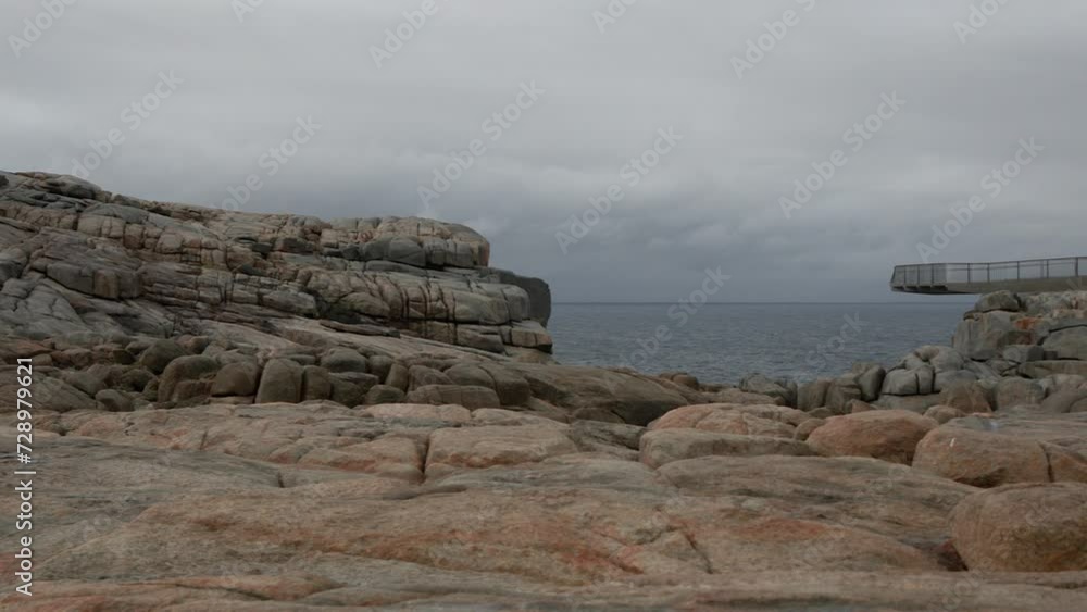 Panning from left to right at the gap, showing the rugged coastline and ...