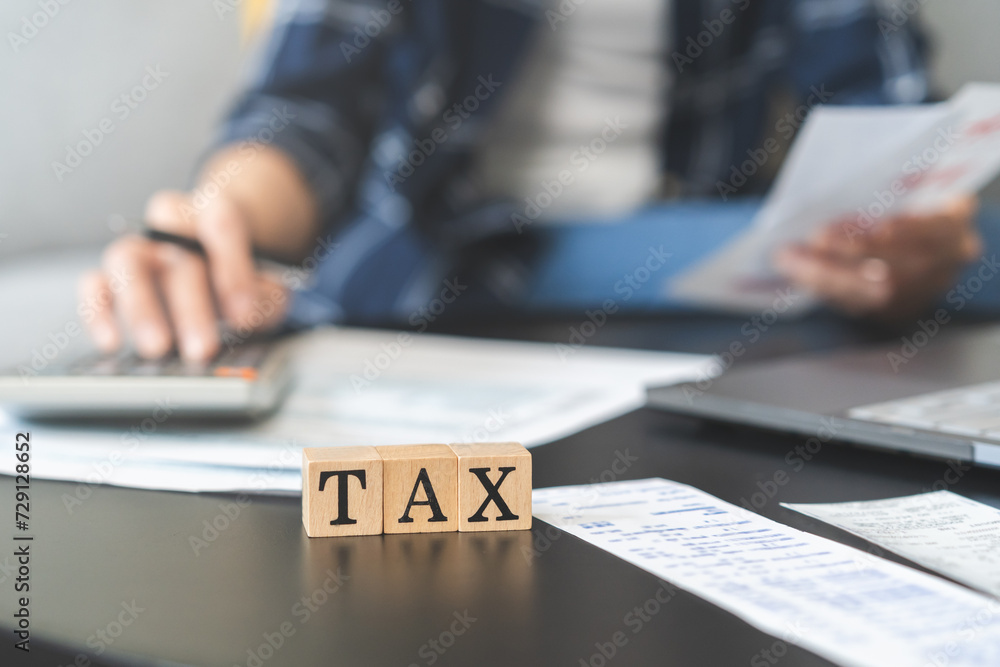 Deduction planning concept, blur background hand using calculator to ...