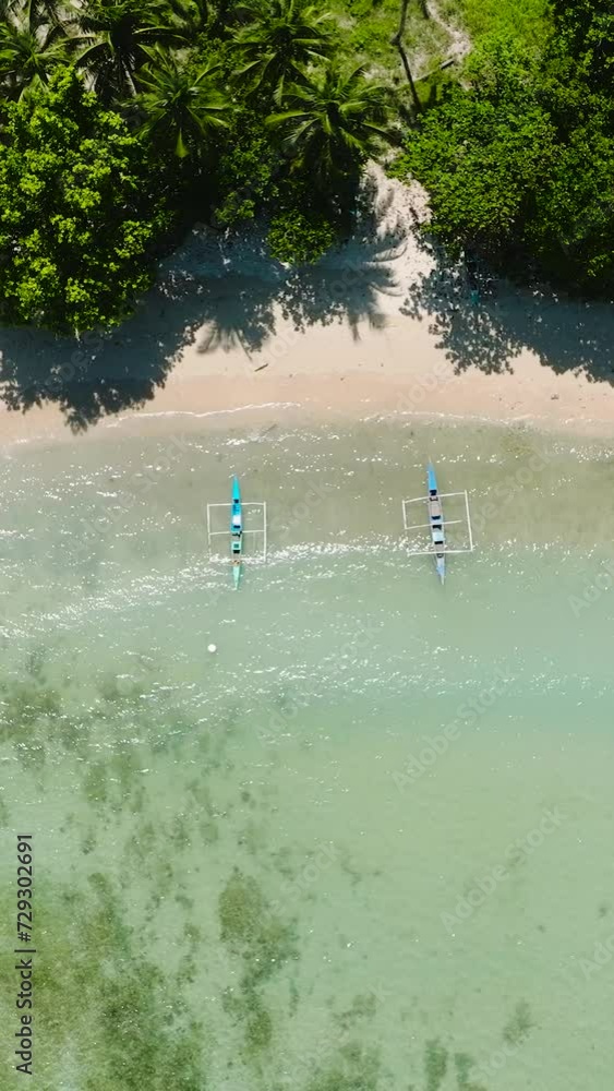 Boats floating over the greenish sea water. Ocean waves on shore in El ...