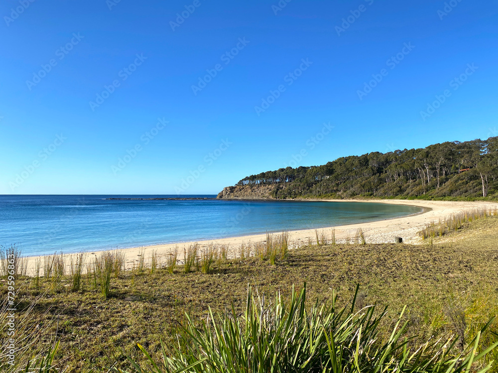 Beach, island and sea. View of bay, sand, waves, mountains and ...