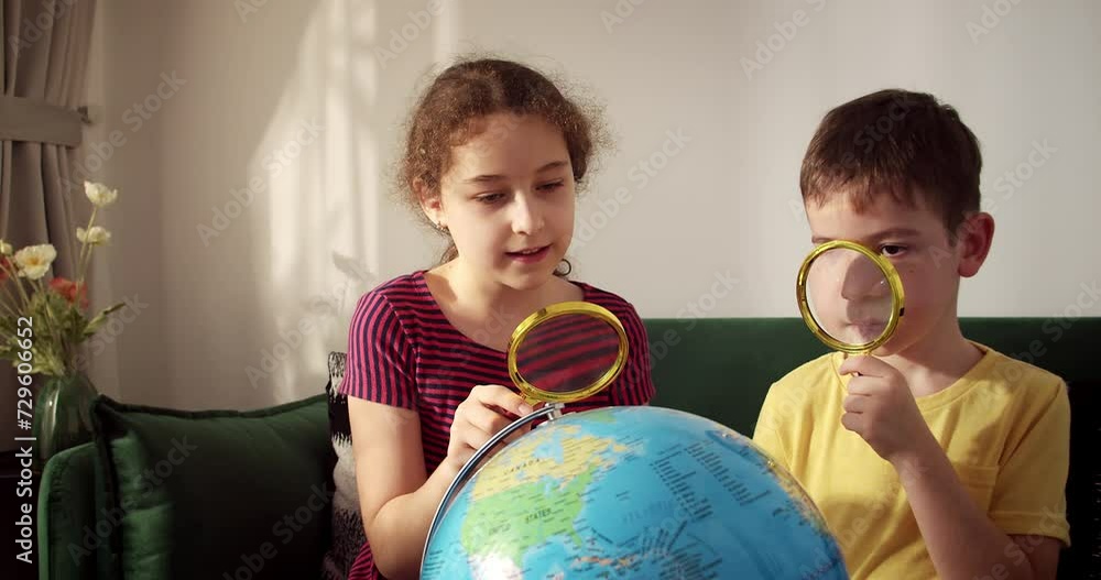 Vidéo Stock Children is studying while sitting at home in rays sunset ...