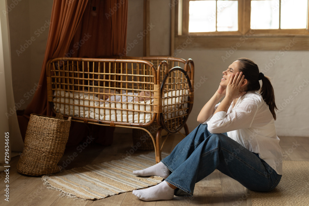 Young mother suffering postnatal depression symptoms, woman sitting on ...