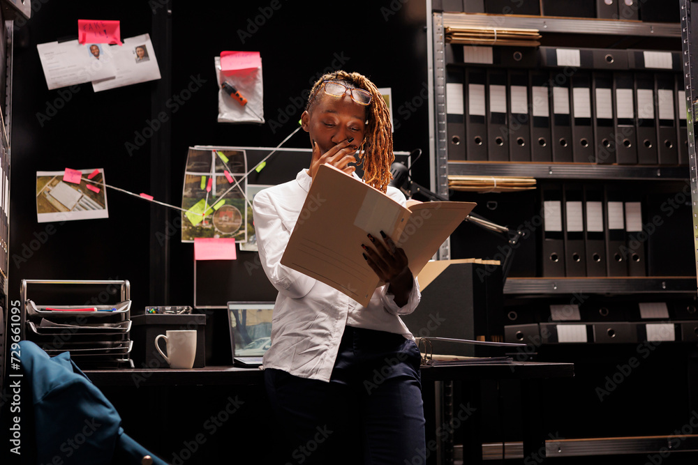 Law enforcement agency detective reading criminal investigation ...