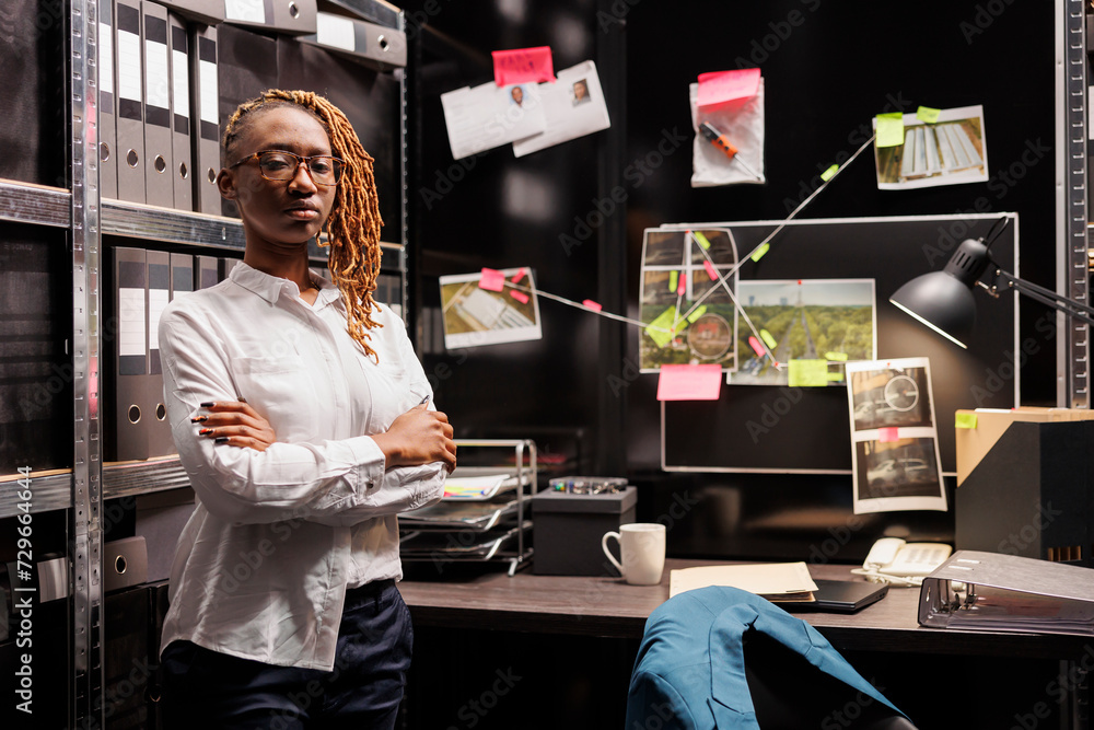 Confident african american woman detective standing with crossed arms ...