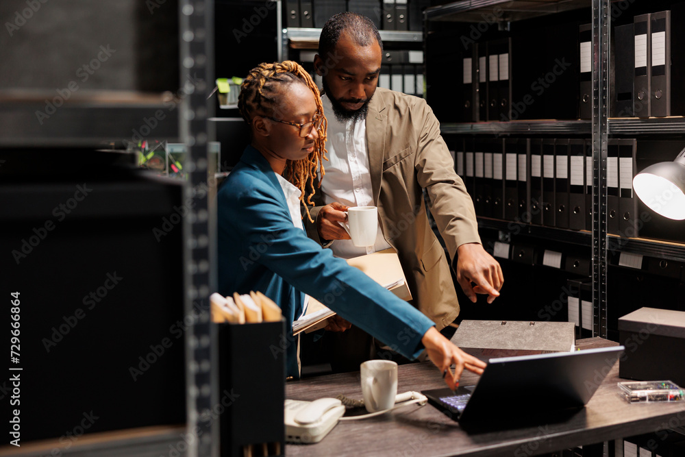 Cops drinking coffee and analyzing crime scene evidence on laptop ...