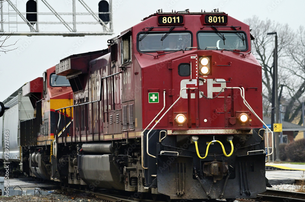 Two locomotives lead a Canadian Pacific Kansas City (CPKC) freight ...