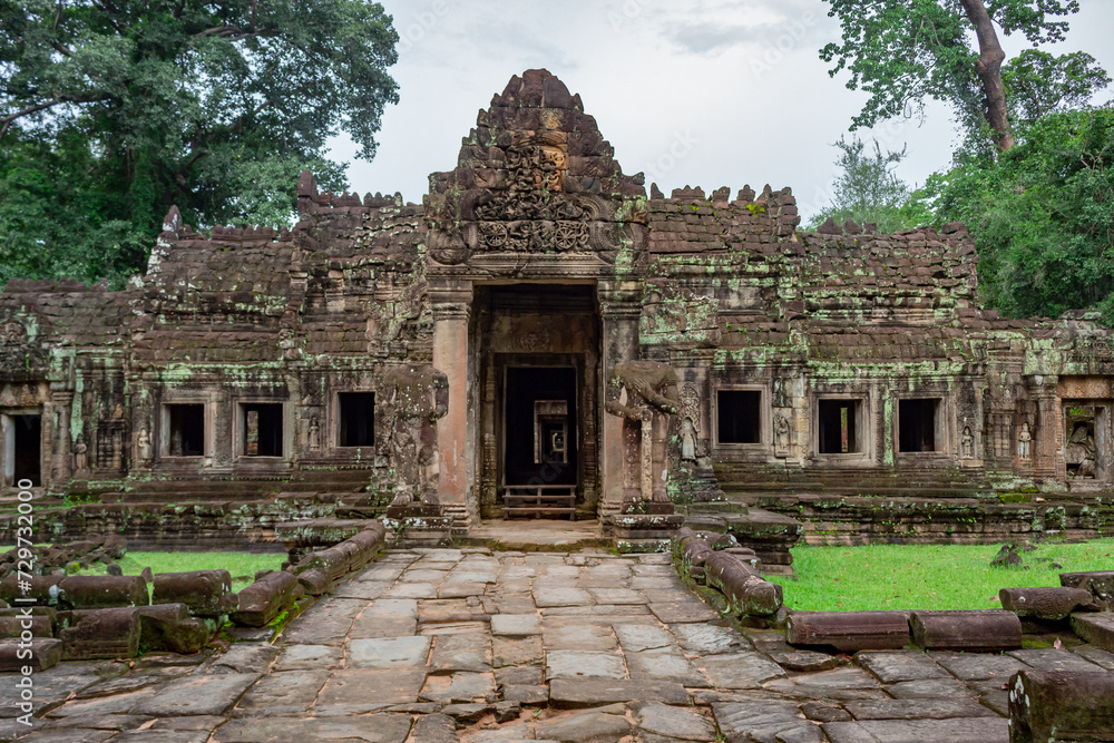 Moss covered green stone brick exterior design of the Preah Khan Temple ...