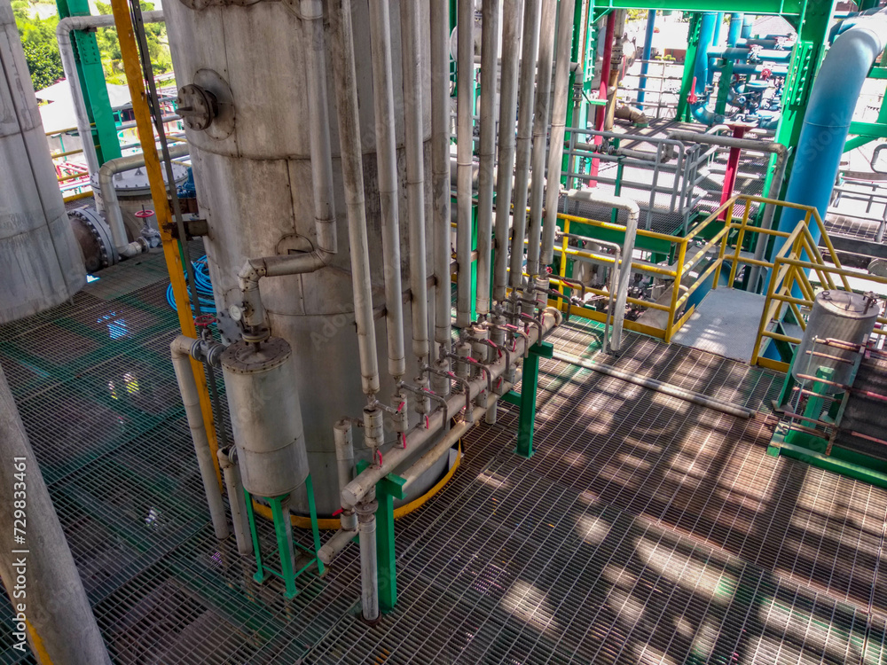 High-angle view of the sample valves of a distillation column. each ...