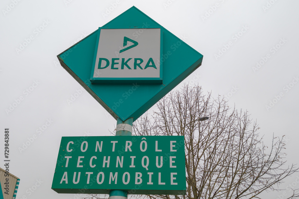 Dekra logo sign and text brand front of entrance chain building garage ...
