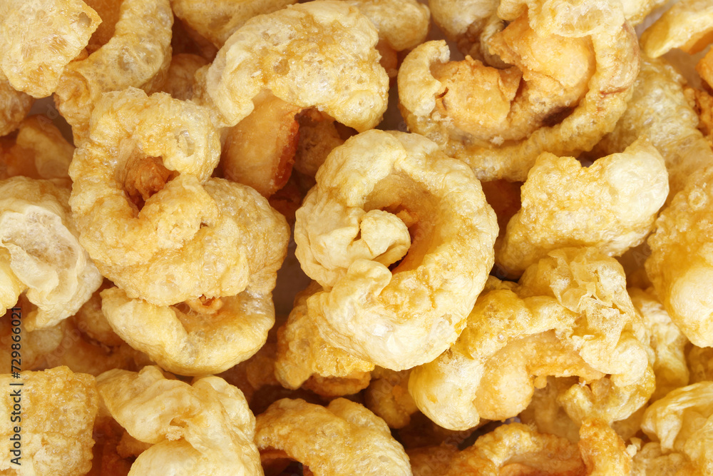 Closeup of pork snack or pork rinds, deep fried pork skin and blistered ...