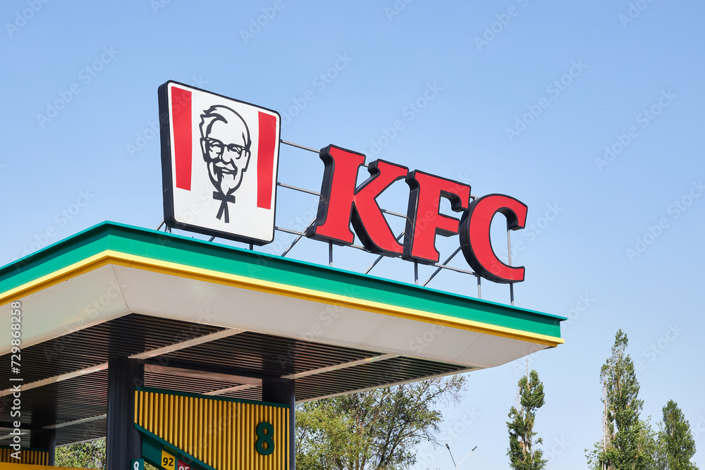 KFC Colonel Sanders logo on roof of gas station. Kentucky Fried Chicken ...