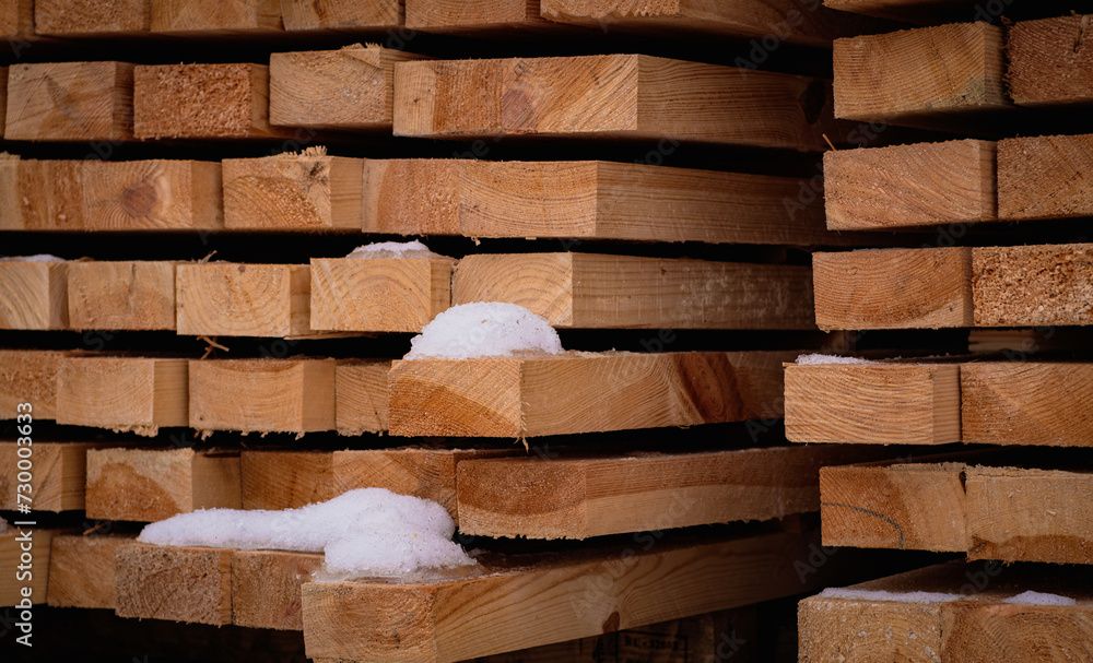 Pine wood timber stack of natural rough wooden boards on building site ...