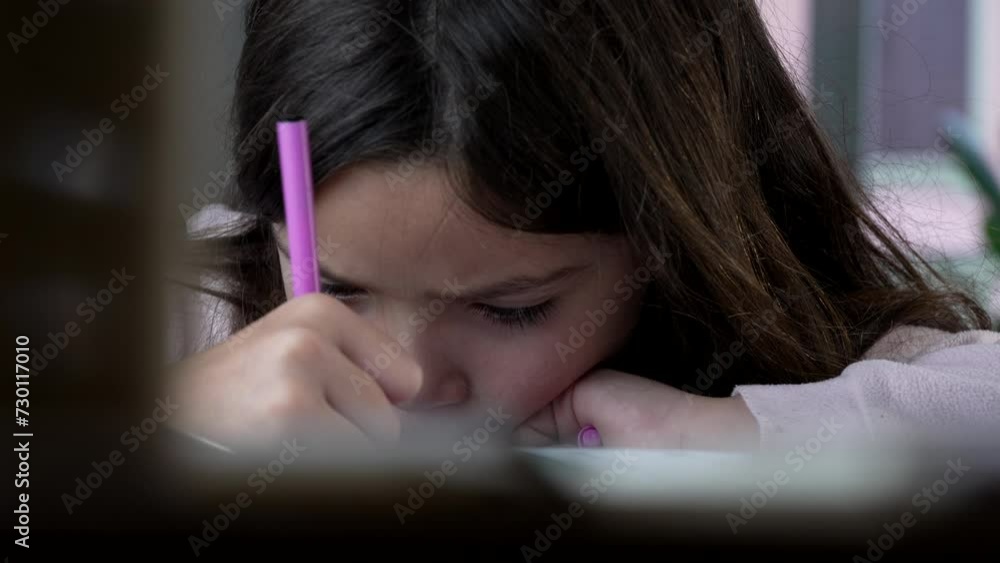 Little Girl Intensely Engaged in Artistic Drawing - Face Close-up. A ...