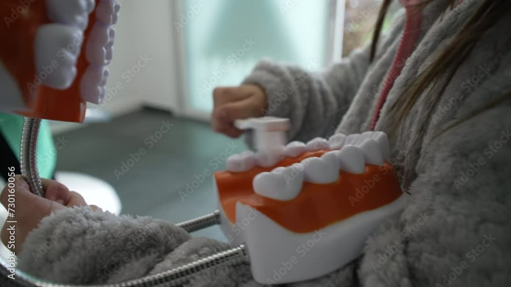 Child hands brushing Giant Teeth Dental Demonstration Model with ...