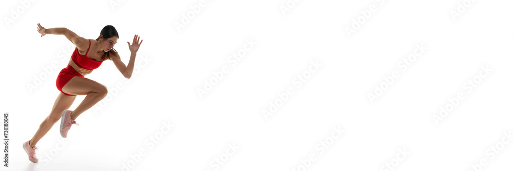 Dynamic side view image of competitive female runner in motion ...