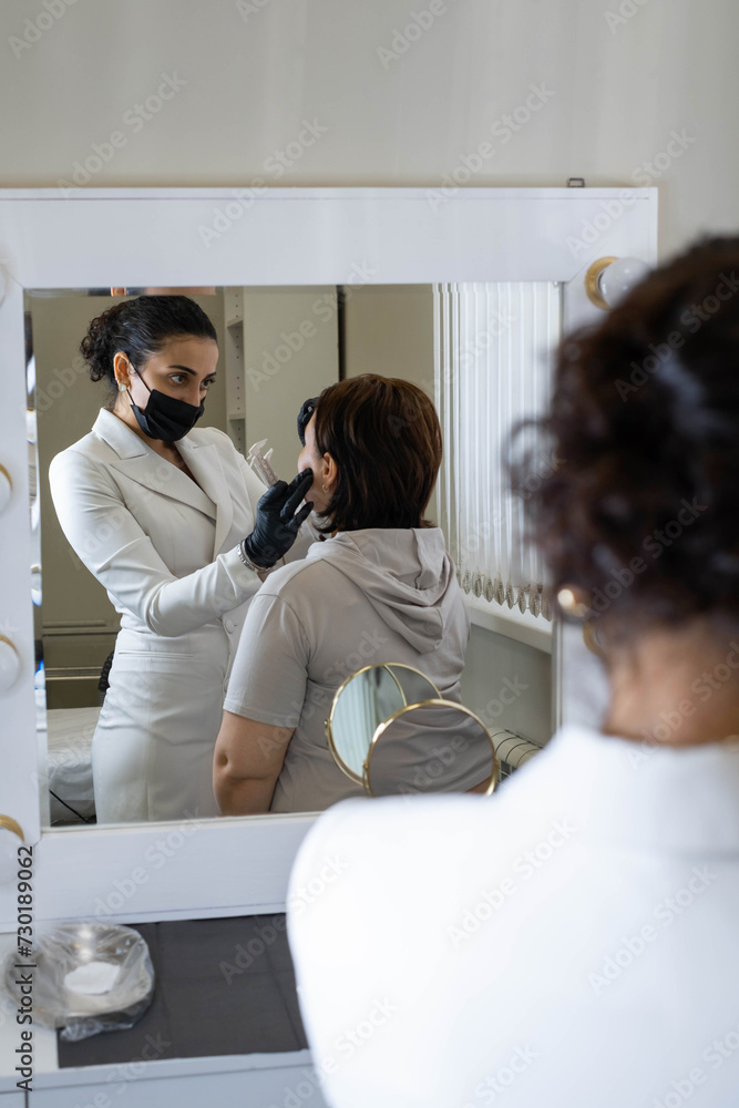 Professional administers a vaccine, focus on precision and care. This ...