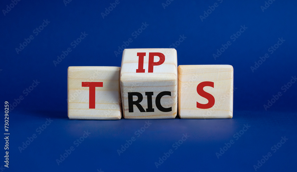 Tips and Tricks symbol. Wooden cubes with words Tricks and Tips ...