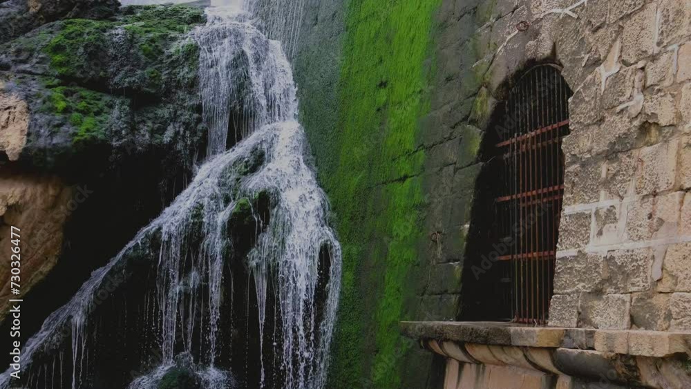 In this captivating slow motion video, a close-up waterfall flows ...