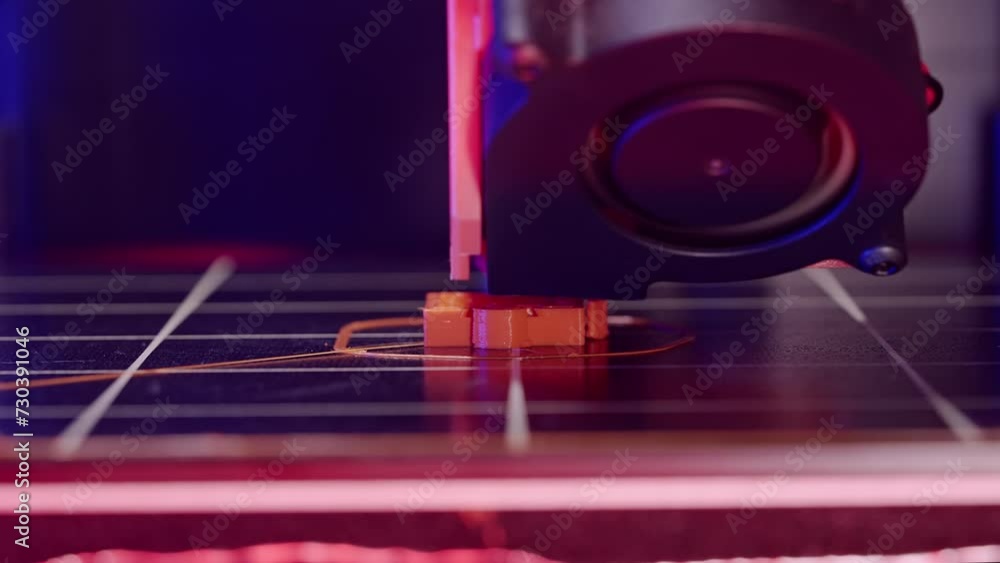 3D printer printing process. The machine head recreates the part from ...