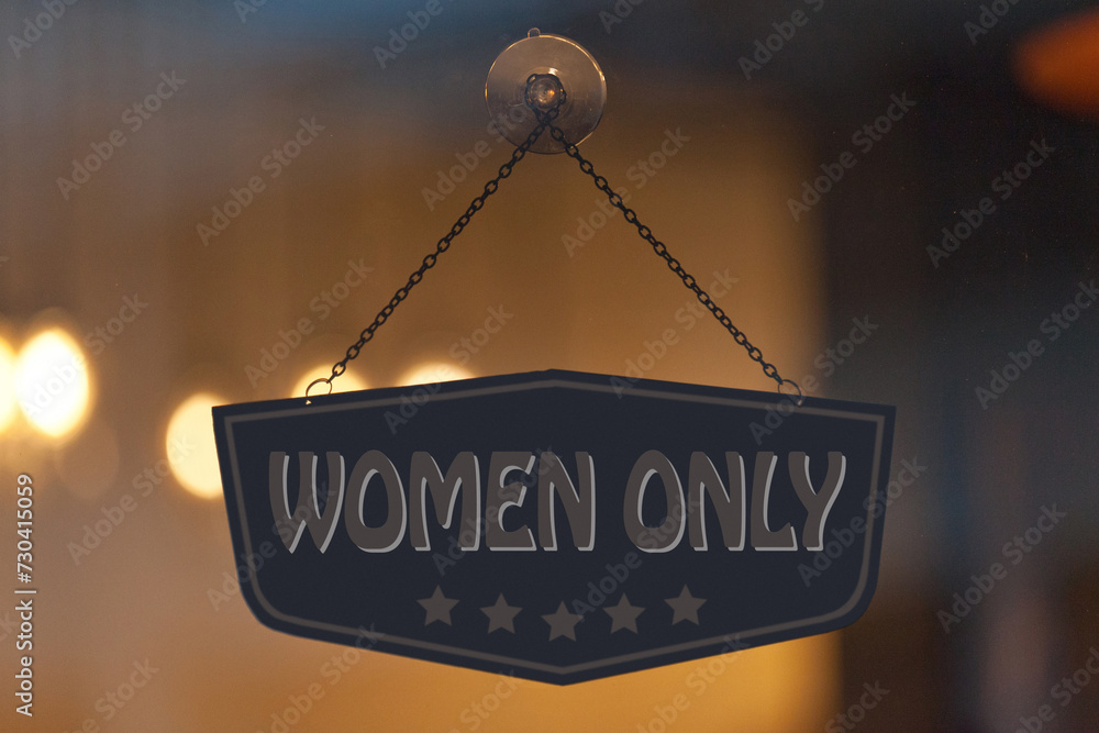 Women only sign in a window Stock-Foto | Adobe Stock