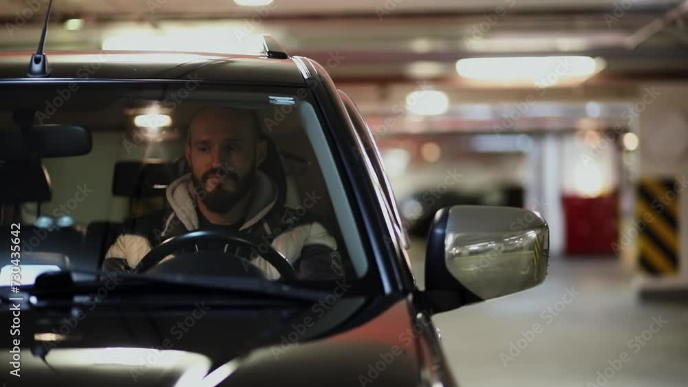 Driver is in car behind front window with reflection during ride ...