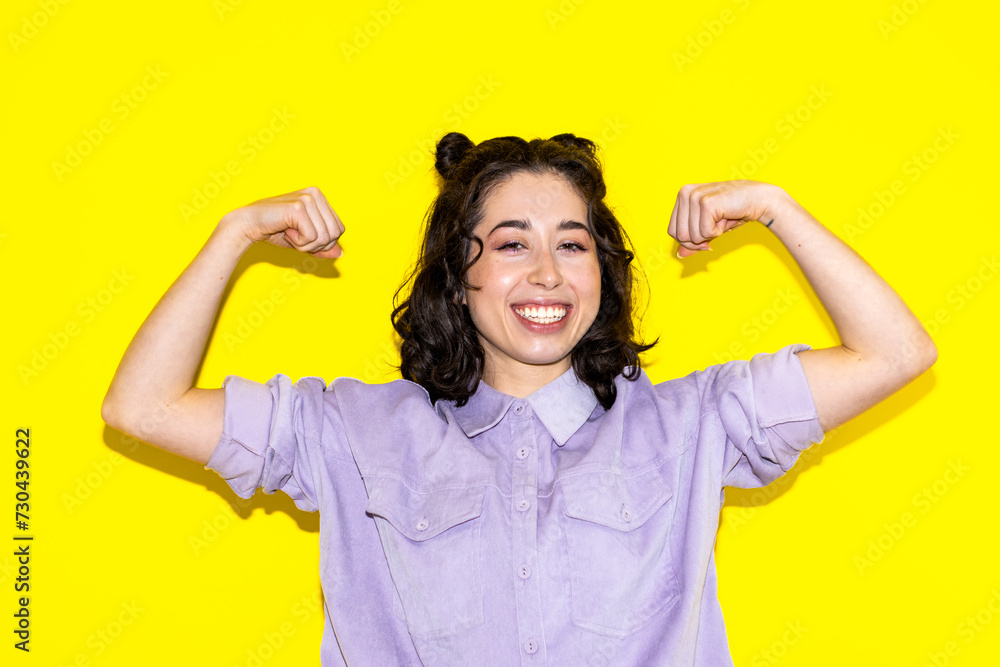 Joyful Woman Flexing Muscles as a Symbol of Female Strength Stock Photo ...