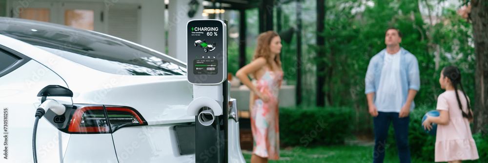Focus electric vehicle recharge from home charging station on blur ...