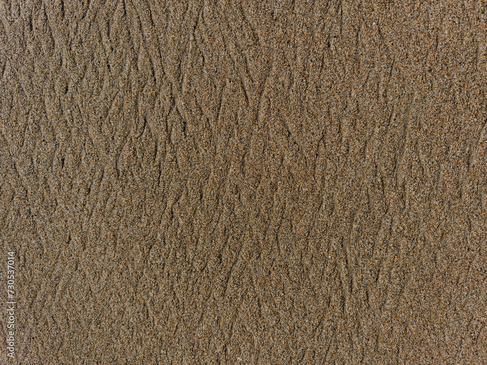 Texture of the sand on a beach in San Francisco after the tide pulls ...
