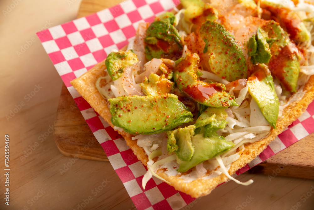 Fried wheat flour toast with pickled pork skin, sour cream and ...