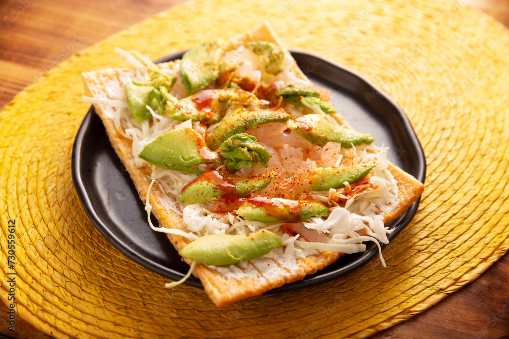 Fried wheat flour toast with pickled pork skin, sour cream and ...