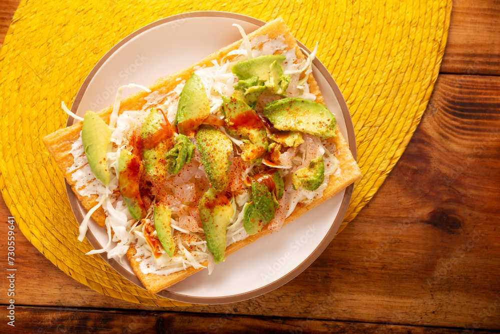 Fried wheat flour toast with pickled pork skin, sour cream and ...