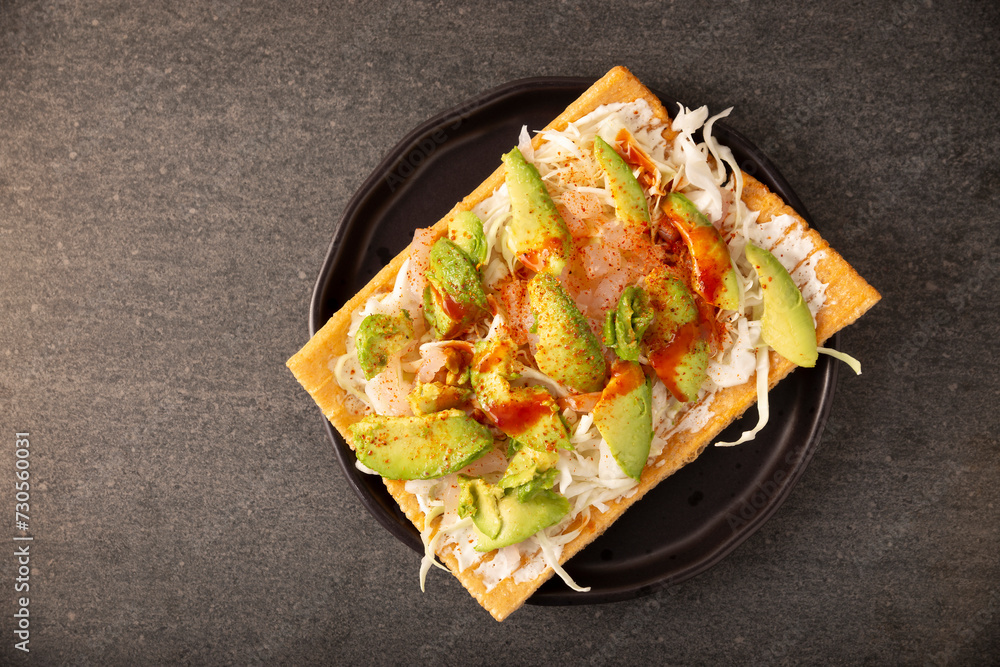 Fried wheat flour toast with pickled pork skin, sour cream and ...