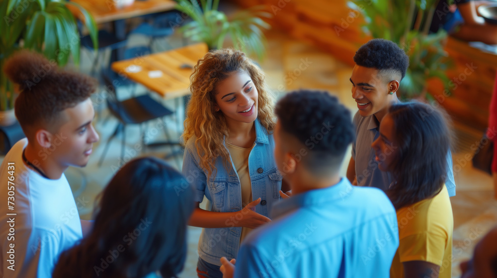 Group of smiling multicultural young people having a friendly ...