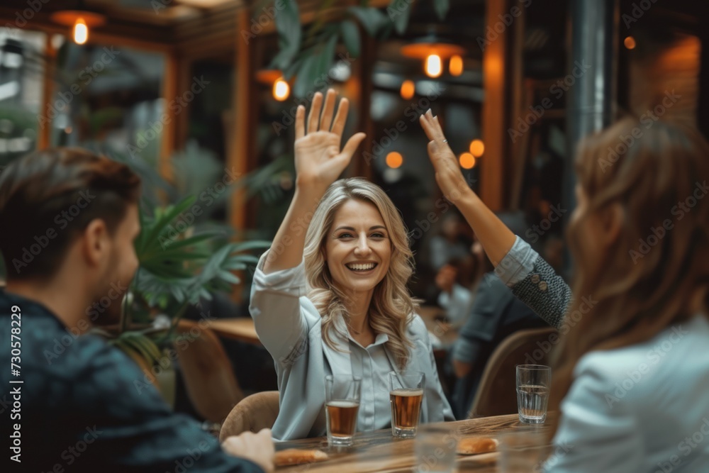 Businesswoman giving a high five to the colleague in meeting room ...