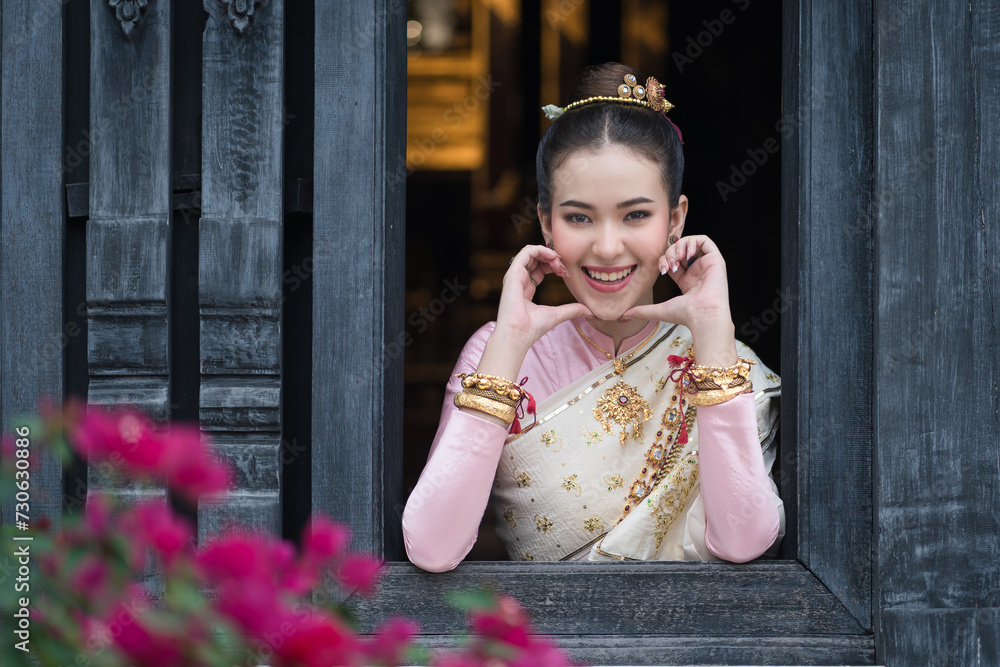 Beautiful girl in traditional Elegant pink dress yellow sash. Fashion ...