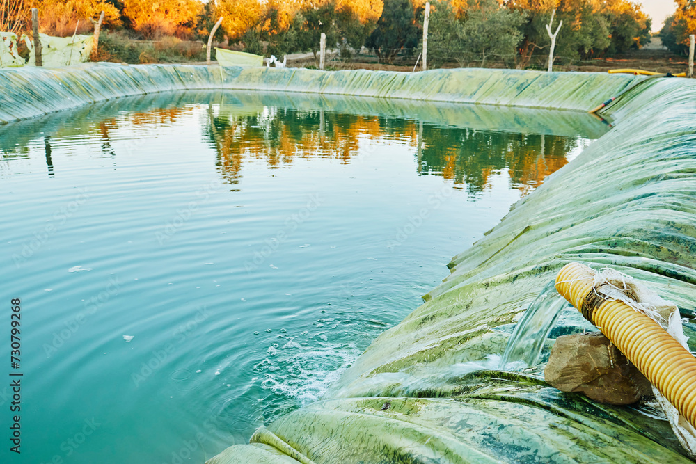 plastic water retention basin for irrigation in agriculture. water that ...