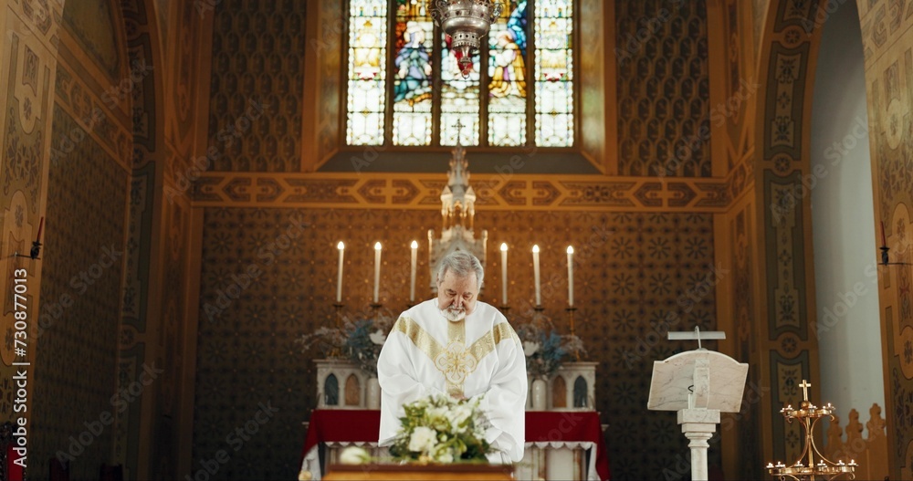 Funeral, church and priest with prayer by coffin for memorial service ...