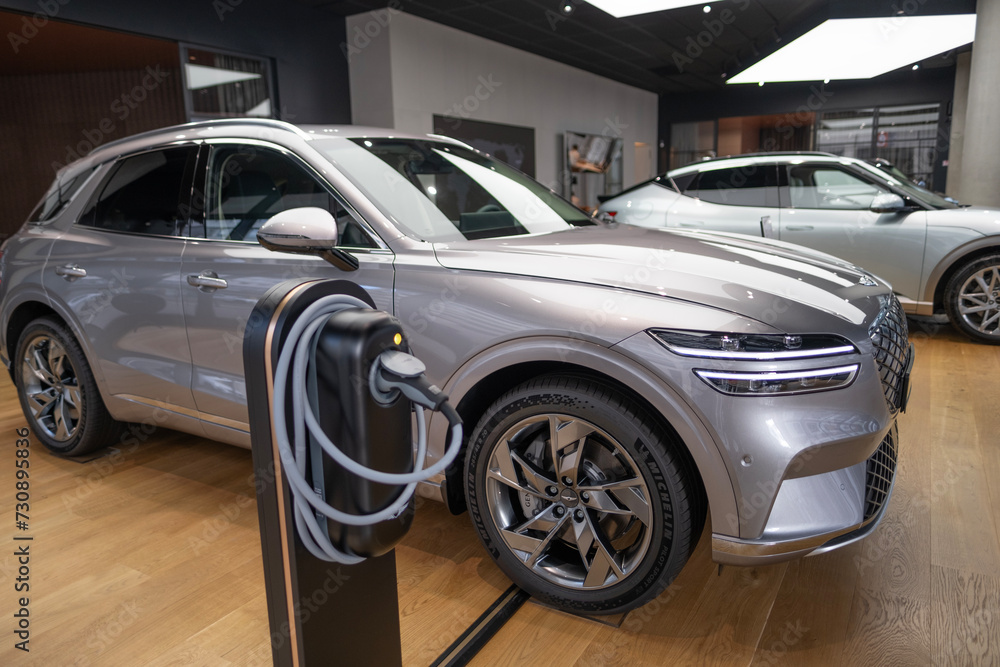 charging station, grey Genesis ELECTRIFIED GV70 all-electric Car ...