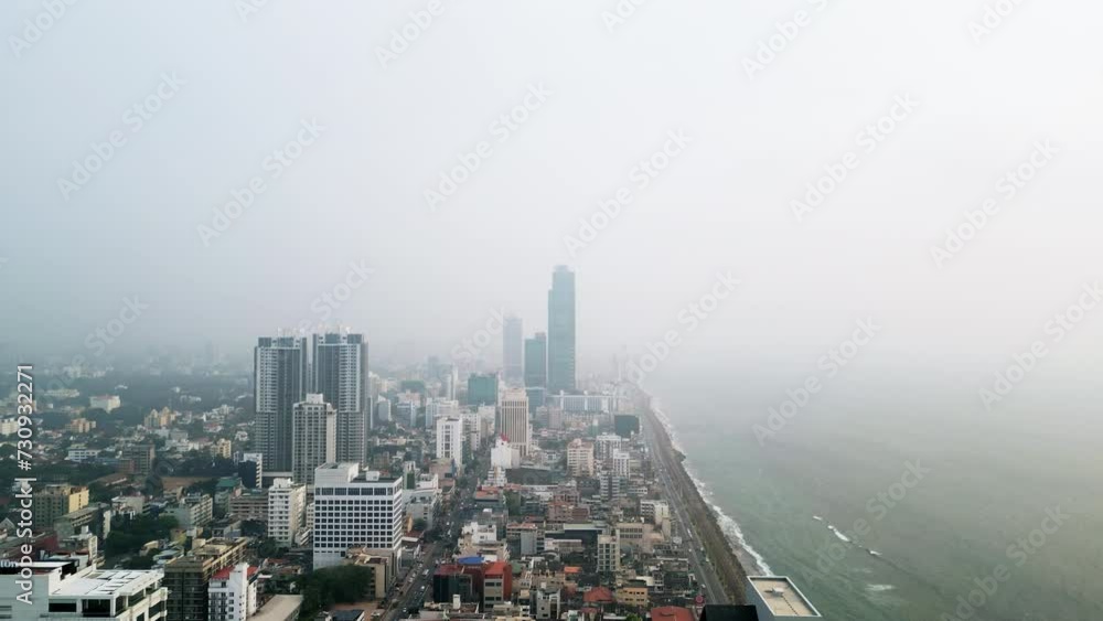 Vidéo Stock Aerial view of Colombo skyline shows urban density along ...