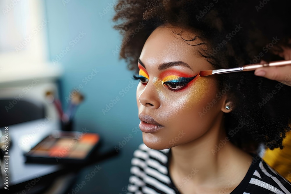 Captivated by her reflection, a woman expertly transforms her features with bold cosmetics ...