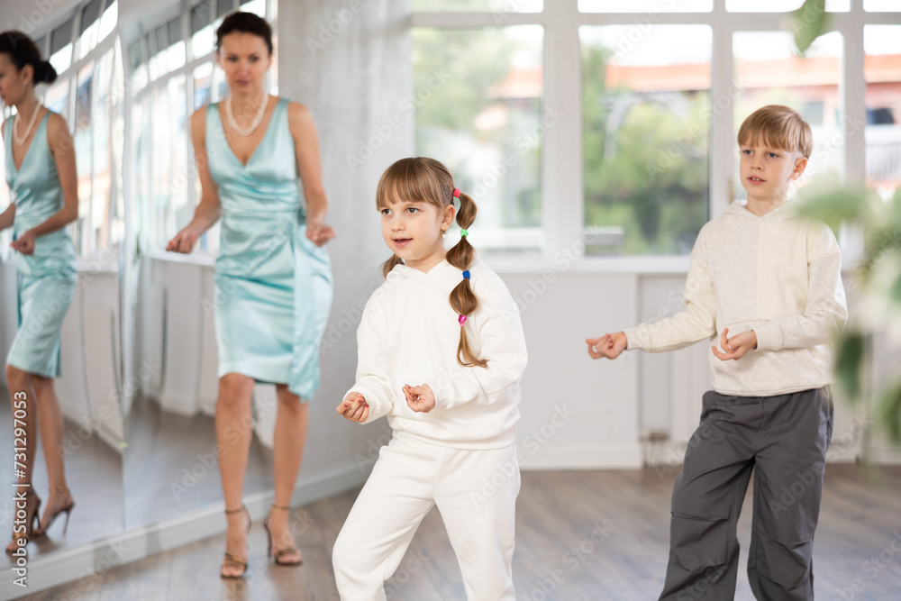 Boy with girl during contemporary boogie woogie dancing lesson ...