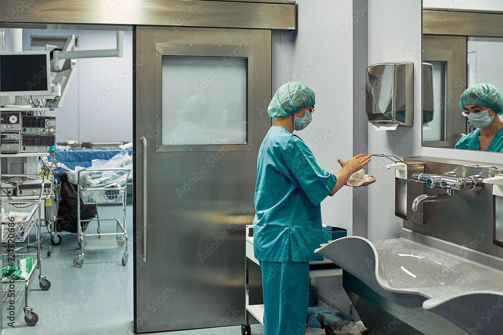The doctor washes his hands before surgery. Sterility concept. A ...