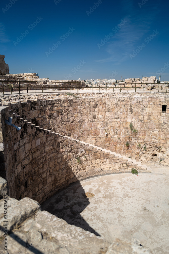 Daytime photo of an old ancient pit for storage of goods or to keep ...