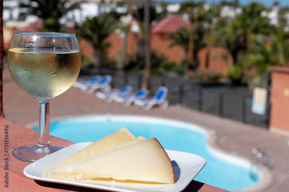 Spanish hard manchego, cow, sheep and goat cheese, cold white wine and ...