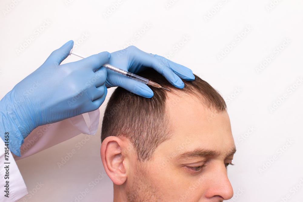 Mesotherapy procedure. A cosmetologist gives an injection with a ...
